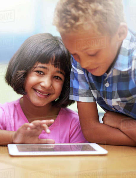 Happy children, tablet and classroom for elearning, education or online ...