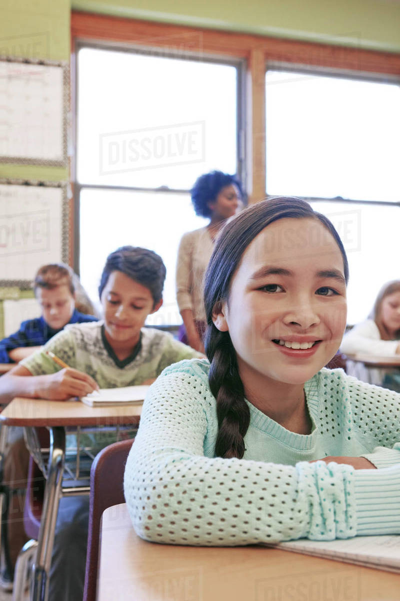 Portrait, girl and classroom for school, education and learning for ...