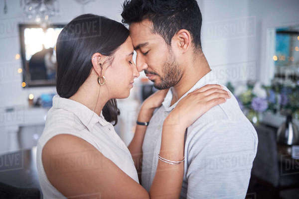 Touching, bonding and couple with forehead together in communication of ...