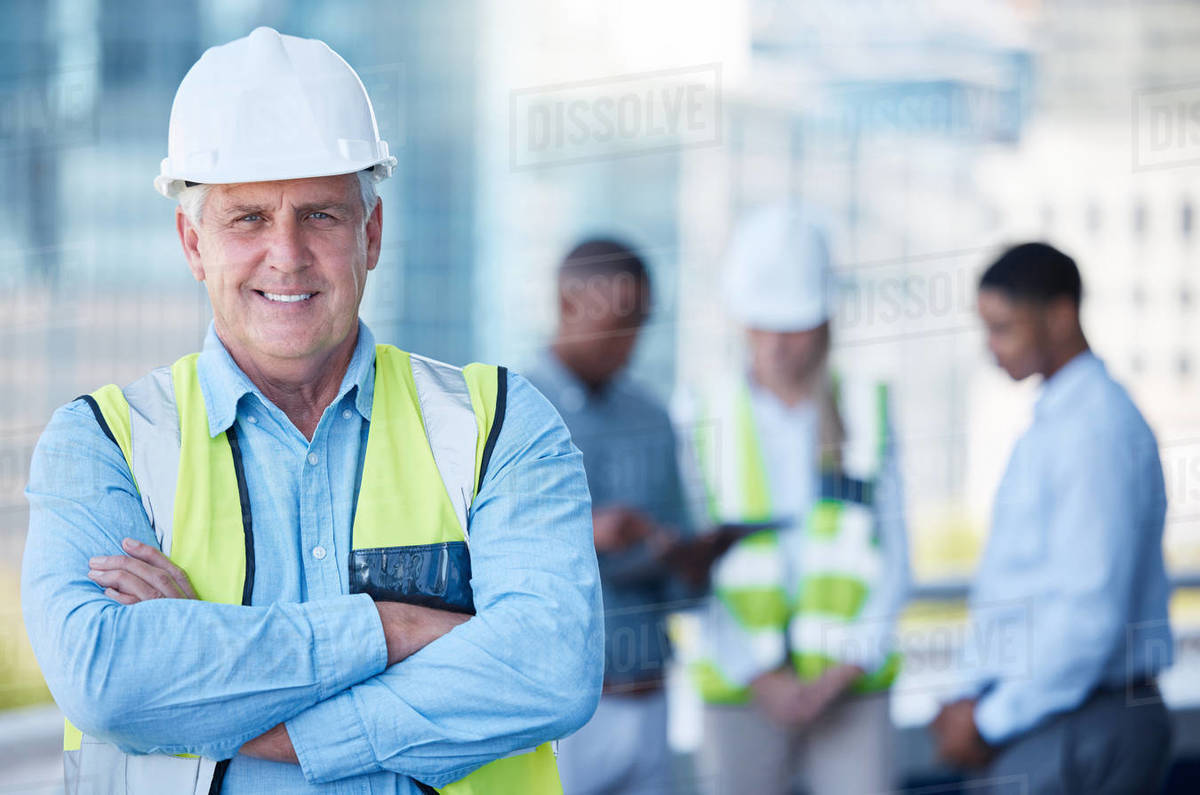 Portrait, arms crossed and a senior man construction worker outdoor on ...