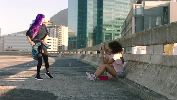 Funky street dancers or performers filming a hip hop dance tutorial or ...