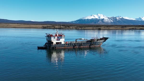 Moored Boat At Puerto Natales In Antartica Chile. Snowy Mountains. Bay ...