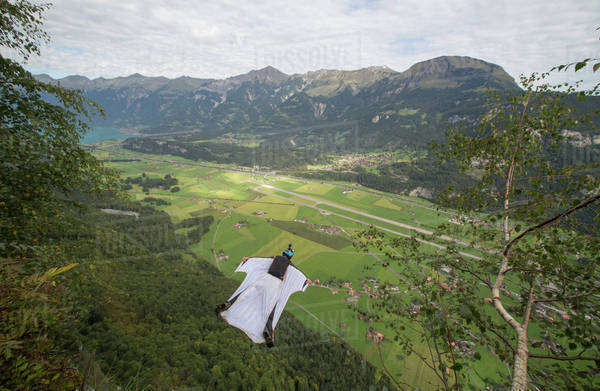 Wingsuit flyer gliding in the air - Royalty-free Stock Photo | Dissolve
