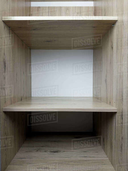 Empty shelf of wardrobe with place for clothes, shelf of wooden ...