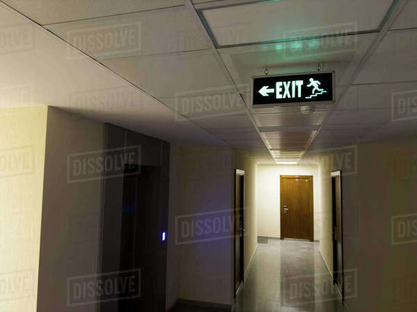Sign on ceiling showing direction to emergency exits along stairs from ...