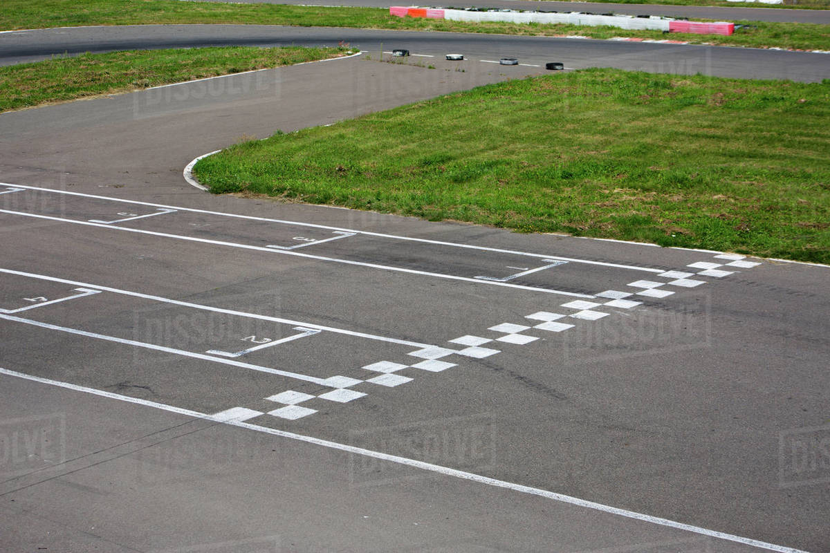 Asphalt track with markings for the correct start of the car in its ...