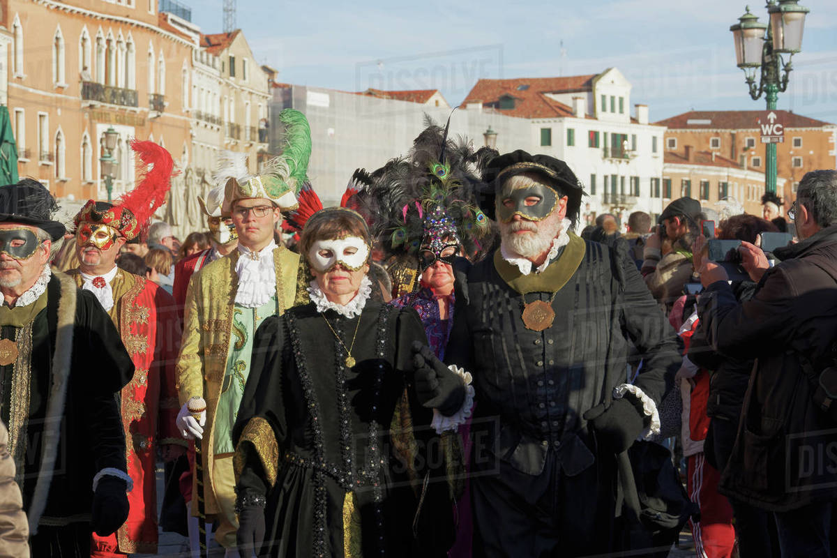 Venice, Italy Carnival mask and costume poses at waterfront.Masked ...