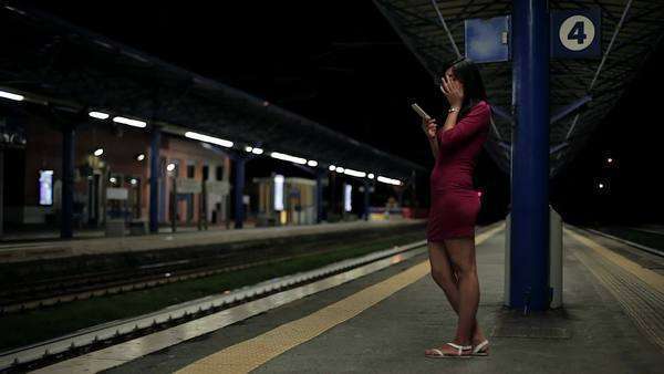 Gorgeous lady waiting for night out at train station - Stock Video ...