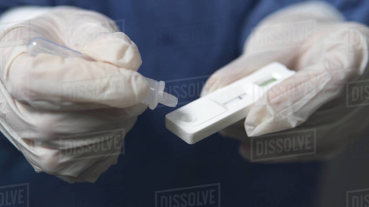 The doctor makes a rapid PCR test for the antigen of the covid-19 virus ...