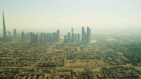 Downtown Dubai skyline Burj Khalifa and suburbs helicopter blades ...