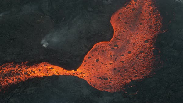 Aerial river of moving red hot liquid magma seaward with lava rock ...
