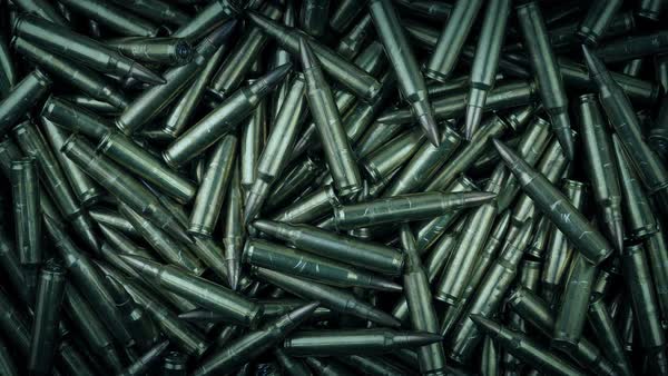 Pile Of Bullets Rotating Top Down View - Stock Video Footage - Dissolve