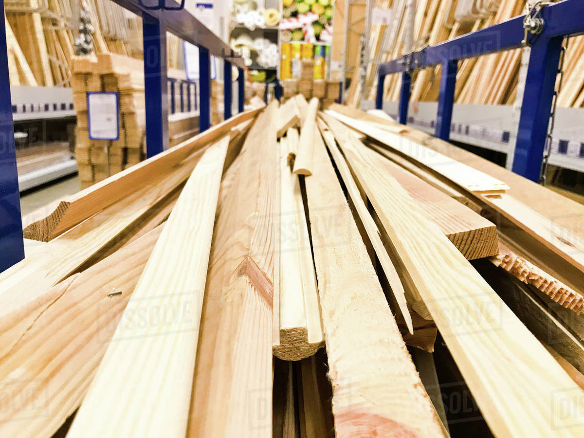 Wooden brown sawn natural building boards stick logs with knots on a ...