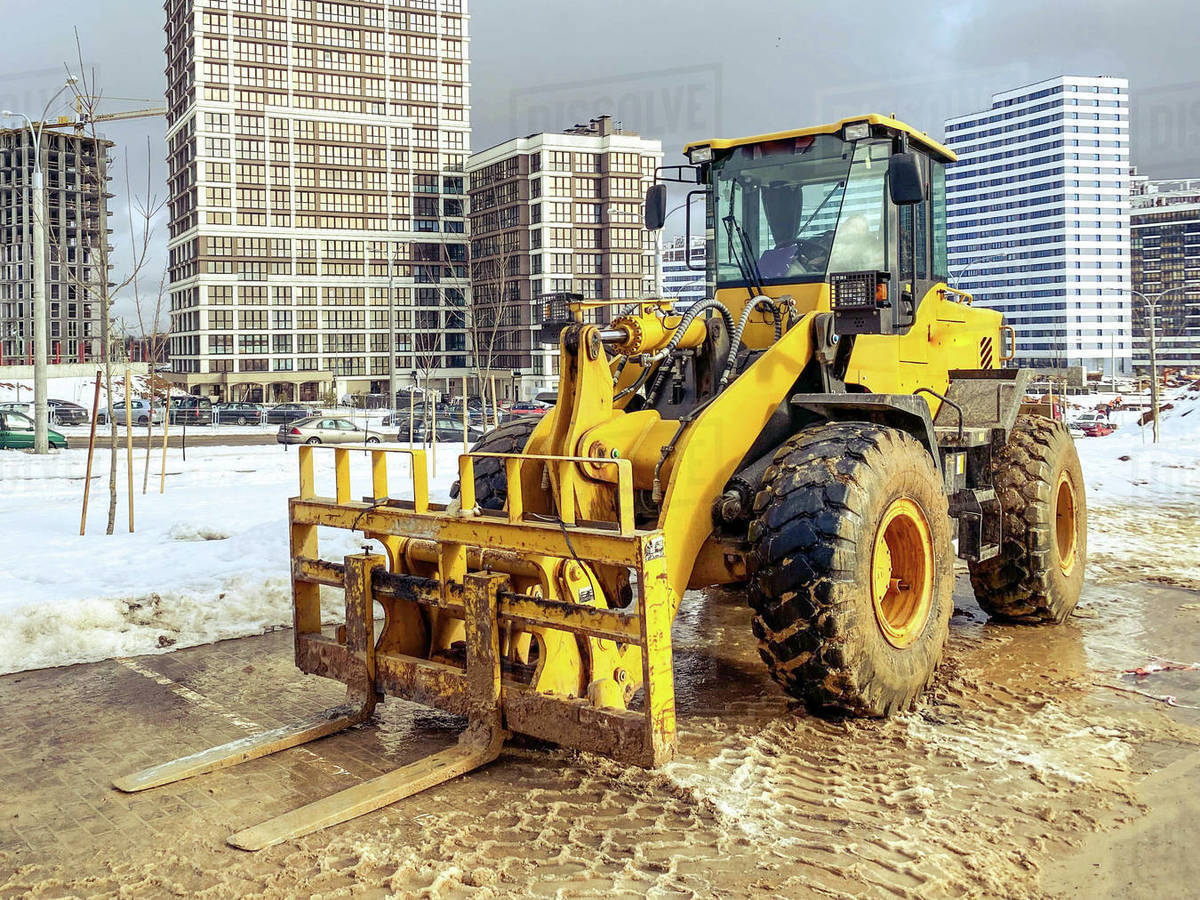 construction equipment on site. construction of houses. bright, yellow ...