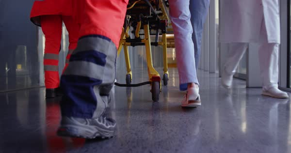 Slow Mo Close Up Of Nurses Legs Pushing Hospital Gurney - 4K Royalty ...