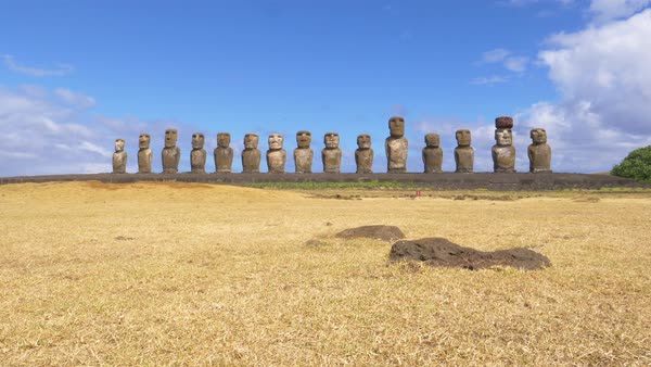 DRONE: Flying towards a row of spectacular monolithic statues with ...