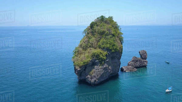 AERIAL Flying around spectacular limestone island on picturesque summer ...