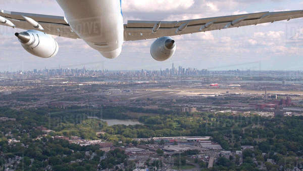 AERIAL, CLOSE UP: Flying towards spectacular New York City as passenger ...
