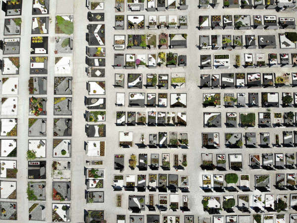 AERIAL, TOP DOWN: Flying above ornated graves and black ornated ...