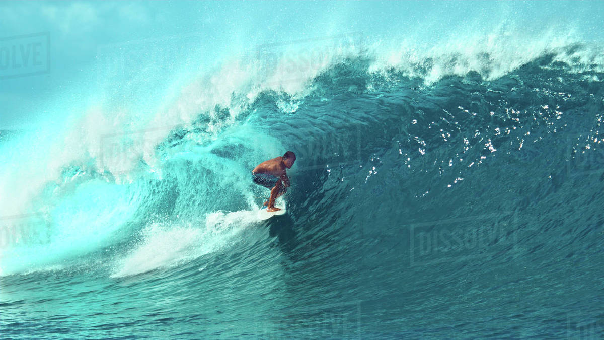 CLOSE UP: Young pro surfer surfs a big barrel wave in popular surf spot ...