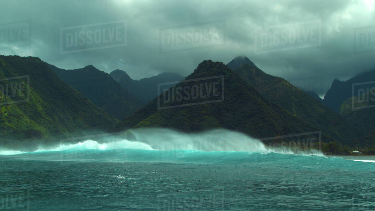 Powerful offshore wind creating large breaking waves near the beautiful ...