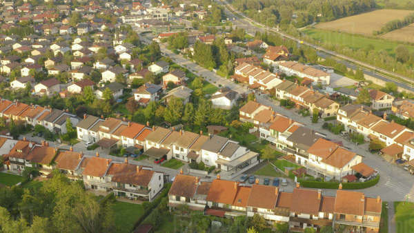 AERIAL: Flying above the middle class housing in a quiet suburban ...