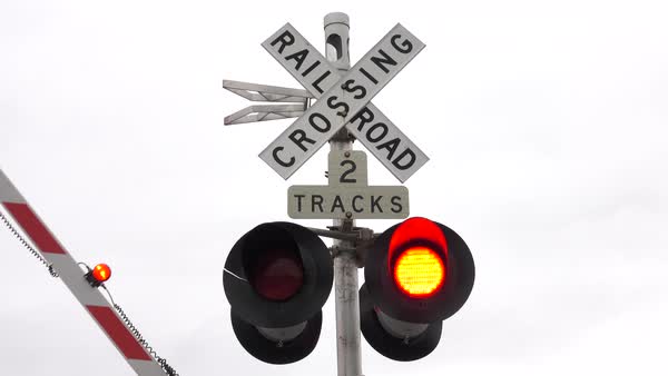 CLOSE UP: Isolated railroad crossing traffic sign with flashing red ...