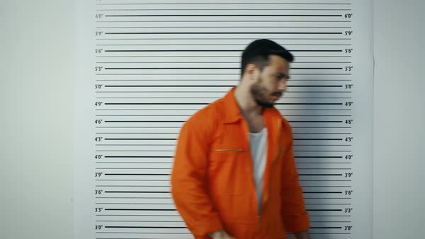 In a police station, male prisoner, female criminal and teenage ...