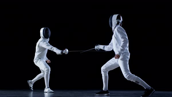 Two Professional Fully Equipped Fencers Expertly Fight with Foils. They ...