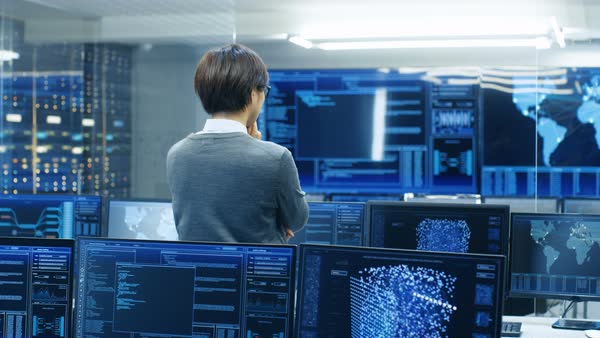 In the System Control Room Technical Operator Stands and Monitors ...