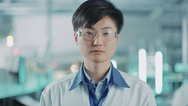 On High-Tech Factory: Portrait of Asian Worker Wearing Uniform and ...