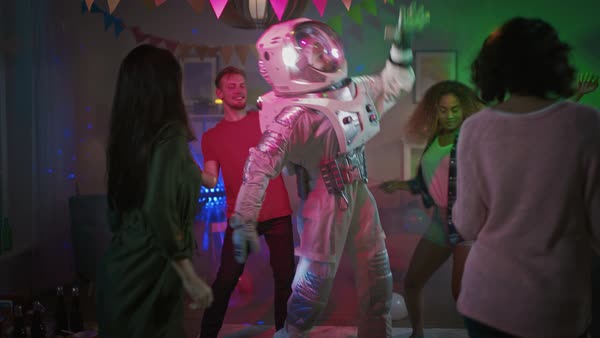 At a House Party: Fun Guy Wearing Space Suit Dances Off, Doing Groovy ...