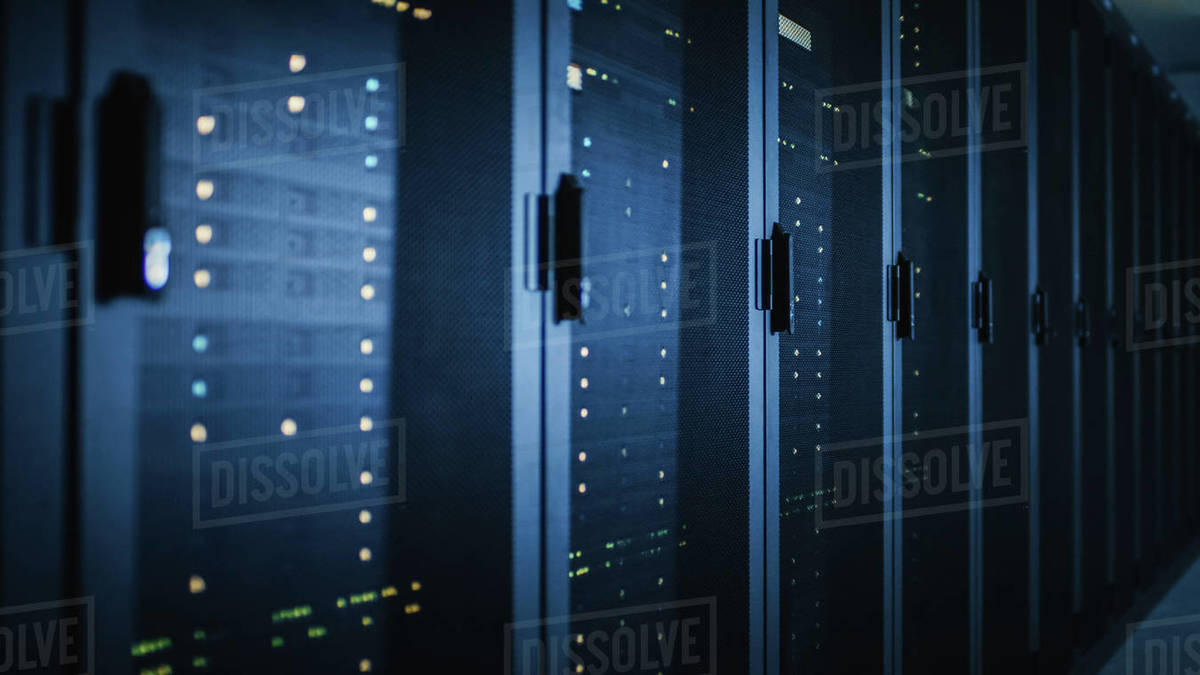 Shot of Dark Modern Data Center With Row of Fully Operational Server ...