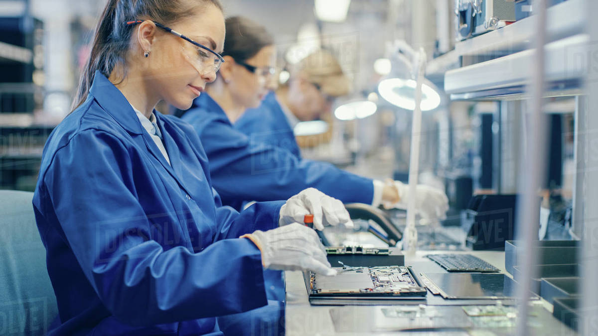 Female Electronics Factory Worker in Blue Work Coat and Protective ...