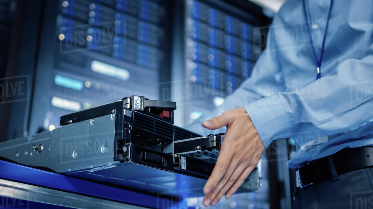 In the Modern Data Center: IT Engineer Installs New HDD Hard Drive and ...