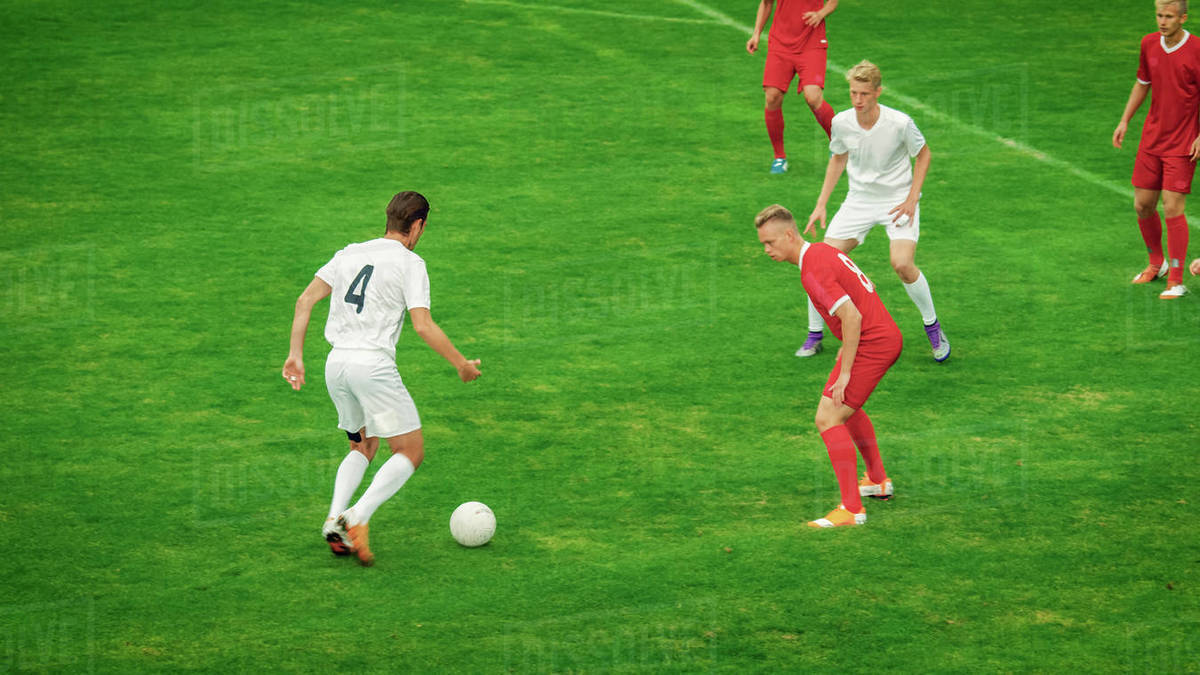 Professional Soccer Players Playing Pass Trying to Score a Goal ...