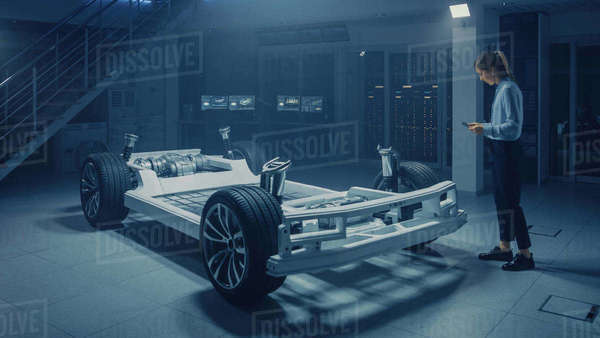 Automobile Engineer Working on Electric Car Chassis Platform, Using ...