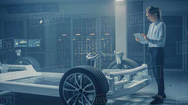 Automobile Engineer Working on Electric Car Chassis Platform, Using ...