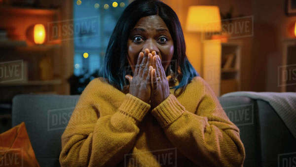 Portrait of a Beautiful Black Girl Sitting on a Couch at Home at Night ...
