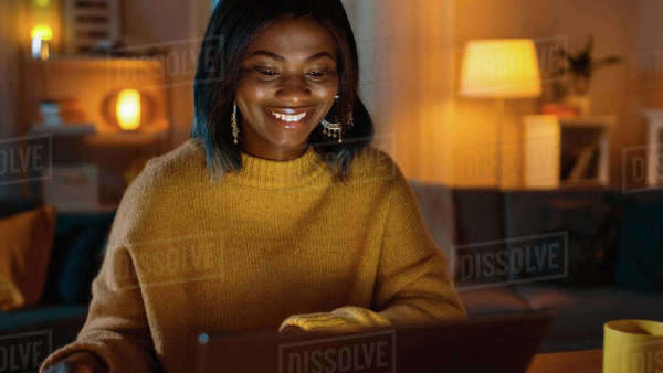 Portrait of Beautiful Smiling Black Girl Working on a Laptop while ...