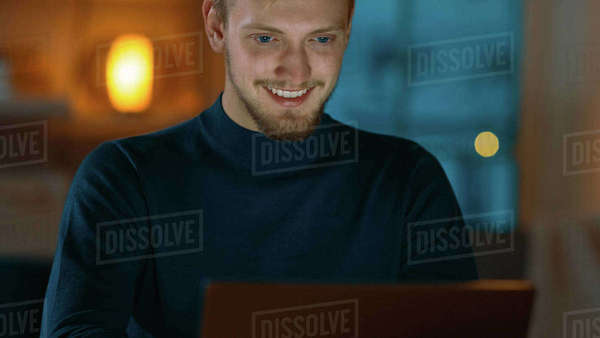 Evening at Home: Portrait of Handsome Man Sitting at His Desk Working ...