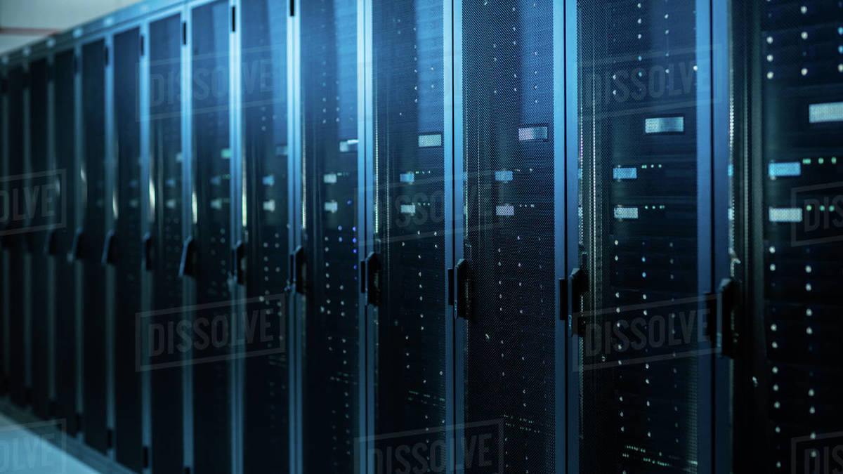 Shot of a Working Data Center With Rows of Rack Servers. Led Lights Blinking and Computers are ...