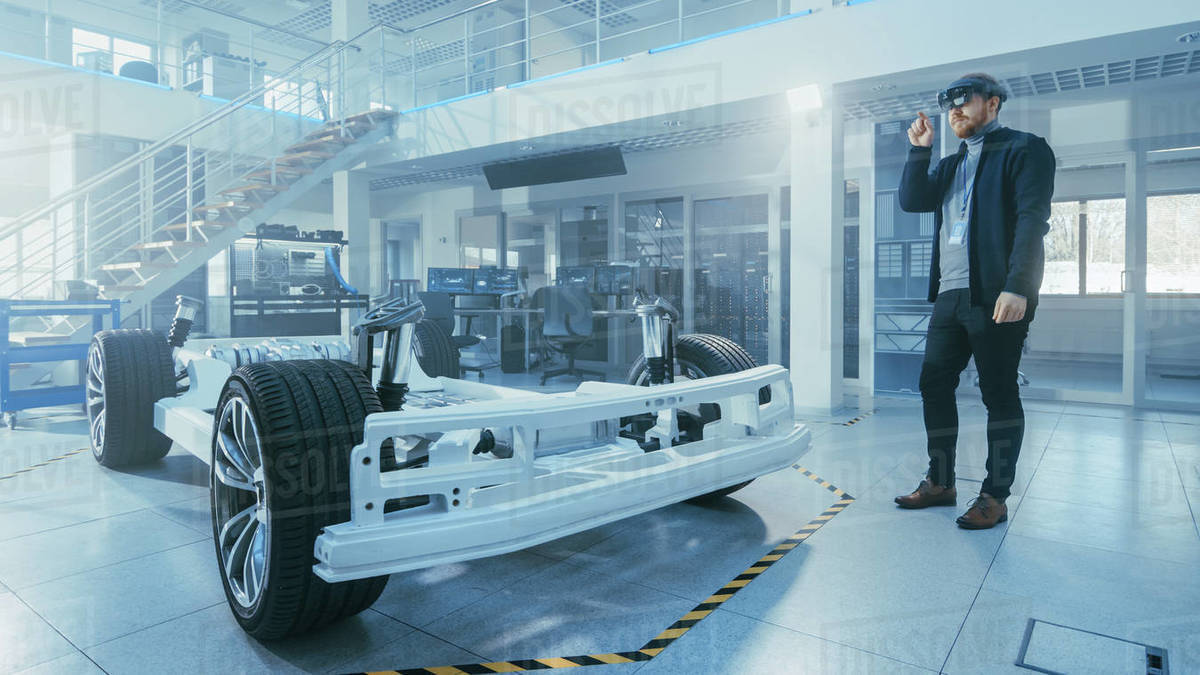 Automotive Engineer Working on Electric Car Chassis Platform, Using ...