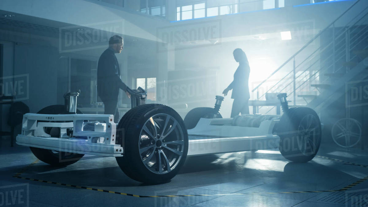 Silhouettes of Two Automobile Design Engineers In Automotive Innovation ...