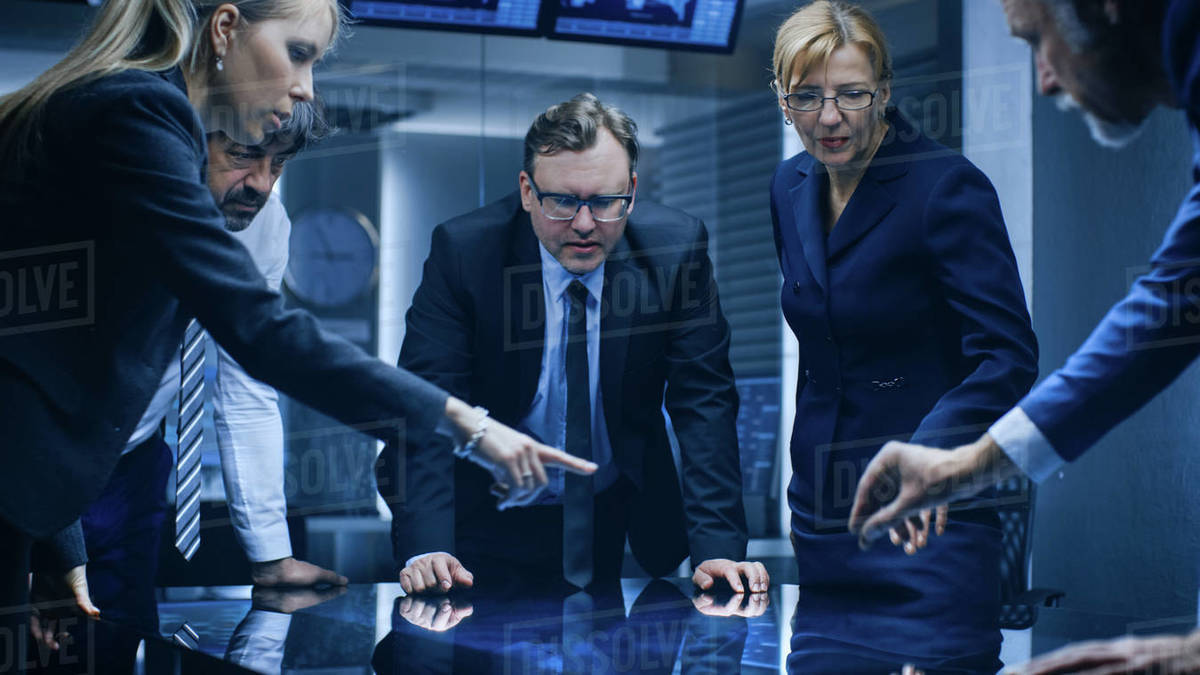 Diverse Team of Government Intelligence Agents Standing Around Digital ...