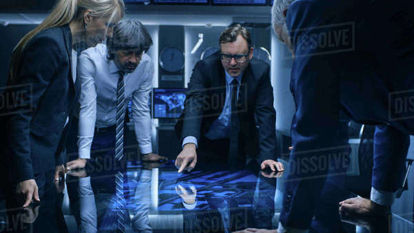 Diverse Team of Government Intelligence Agents Standing Around Digital ...