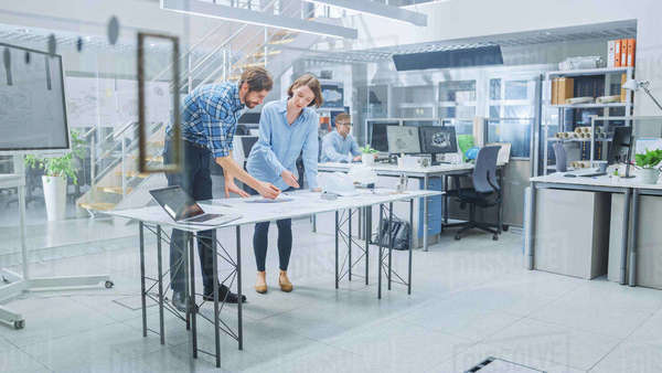 In the Busy Engineering Facility: Diverse Group of Engineers ...