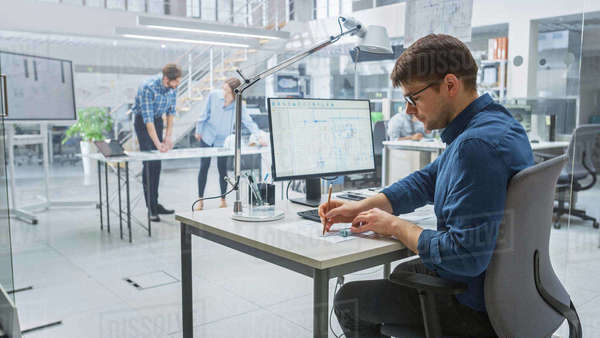 In the Busy Engineering Facility: Diverse Group of Engineers ...