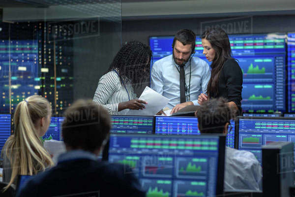 Multi-Ethnic Team of Traders is Busy Working at the Stock Exchange ...
