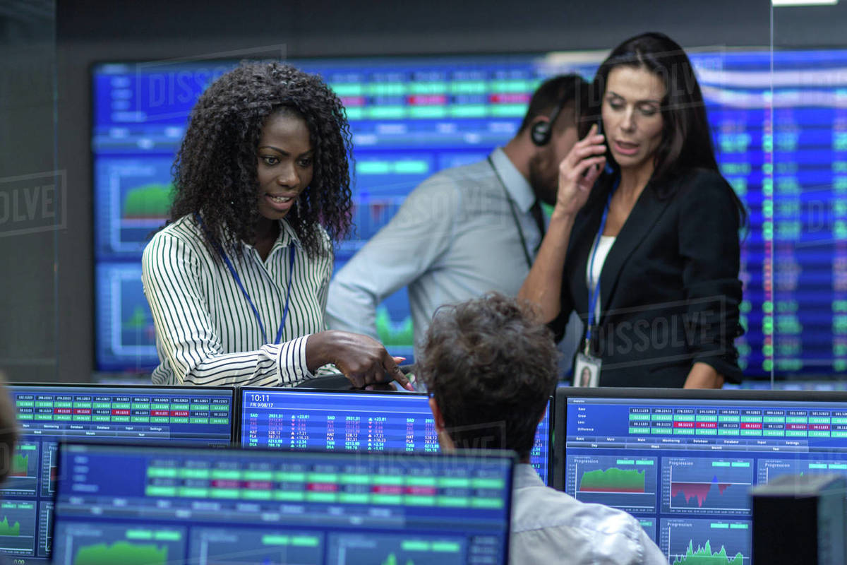 Three Experienced Stock Traders Talking Business, Consulting Documents ...